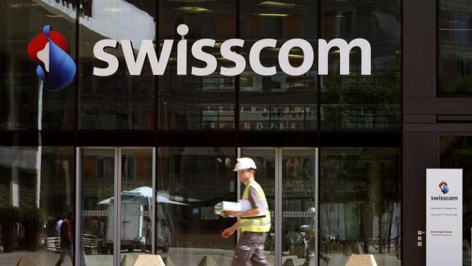 The logo of Swiss telecom company Swisscom AG is seen at an office ...